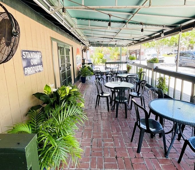 The outdoor patio: where Florida sunshine meets New England flavor. Those plants aren't just decoration—they're witnesses to countless seafood epiphanies.