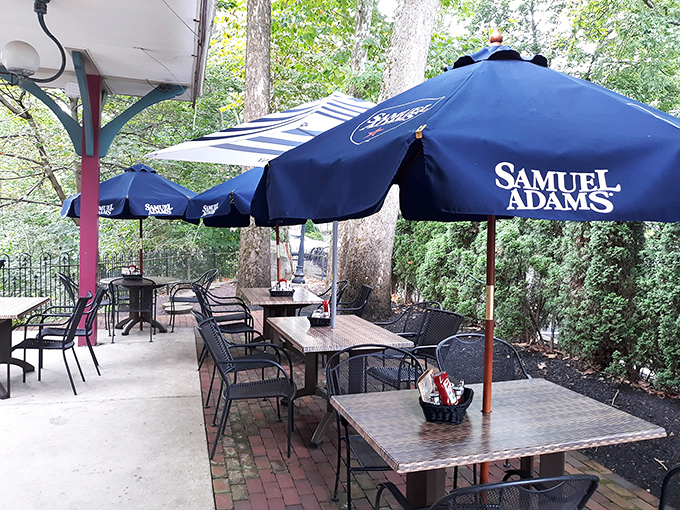 The outdoor patio whispers sweet promises of al fresco dining under Samuel Adams umbrellas—Pennsylvania summers were made for this.