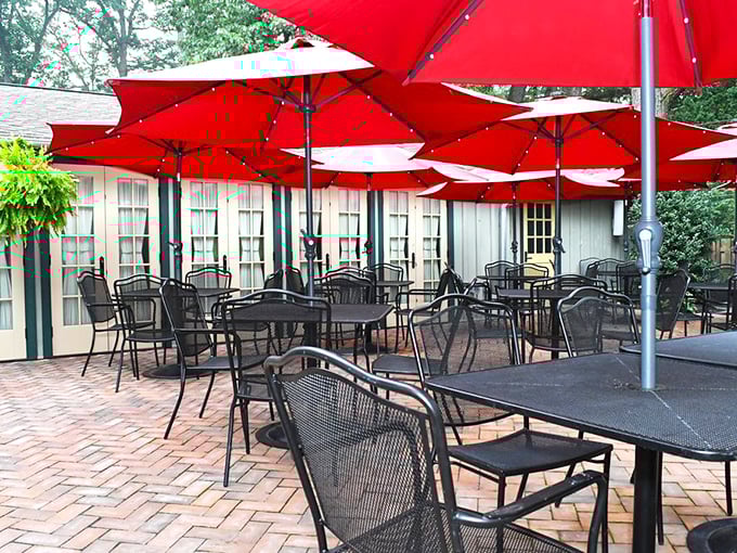 Summer dining under crimson umbrellas – an outdoor patio where Amish buggies might clip-clop past while you sip something spectacular.