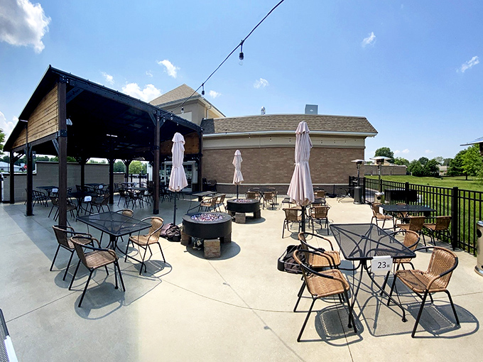 The outdoor patio—where fresh air enhances every sip and bite. Those fire pits aren't just for show; they're conversation starters.