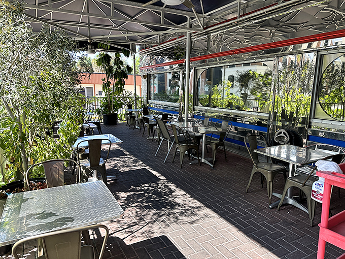Florida sunshine filters through lush greenery in this outdoor oasis, where breakfast tastes even better with a side of vitamin D.