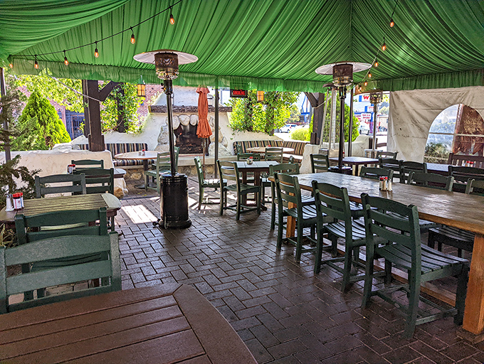 The outdoor patio offers a breezy alternative to the cozy interior—same legendary food, just with California sunshine filtering through the green canopy.