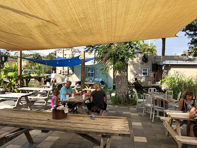 The outdoor seating area offers Florida's favorite dining combination: fresh seafood and fresh air. Those shade sails aren't just practical—they're a kindness.
