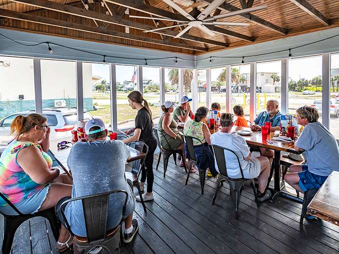 The screened patio offers the perfect compromise—all the fresh air of outdoor dining without uninvited flying guests joining your table. Pure Florida genius.