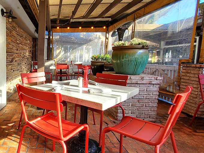 Patio seating that transforms Arizona's sunshine into the perfect dining companion, with those red chairs practically winking at you.