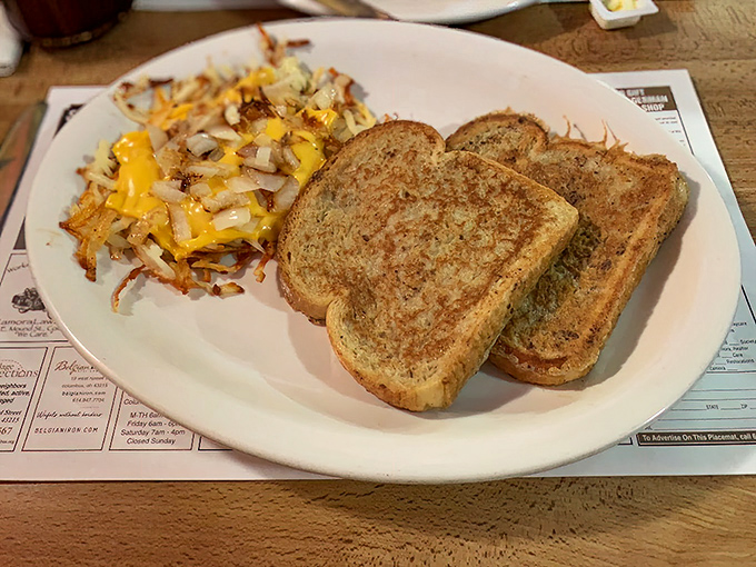 Golden toast and hashbrowns that could make a food photographer weep. Simple perfection on a white plate.