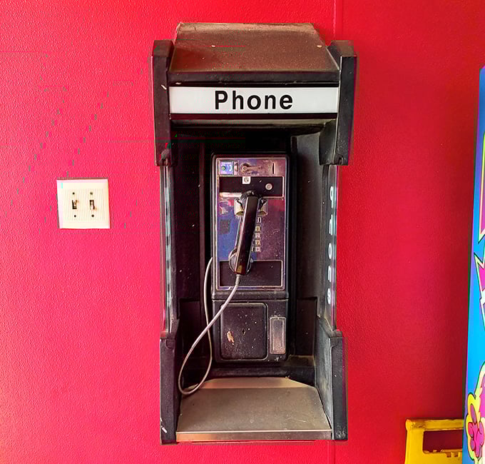 A real phone booth in 2025? This place respects tradition almost as much as their legendary barbecue recipes.