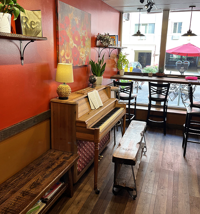 The piano corner—where caffeine, carbs, and occasional Chopin create the perfect ambiance for lingering conversations.