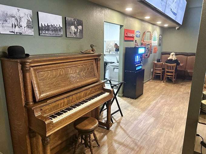 An antique piano stands ready for impromptu entertainment—because nothing pairs with a good steak like a little honky-tonk serenade.