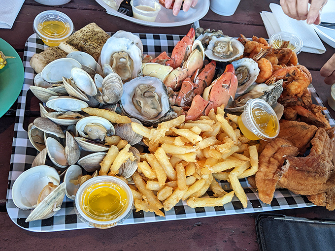 The seafood platter that makes grown adults gasp with delight. Clams, oysters, shrimp, and crab living harmoniously on one plate—a United Nations of deliciousness.
