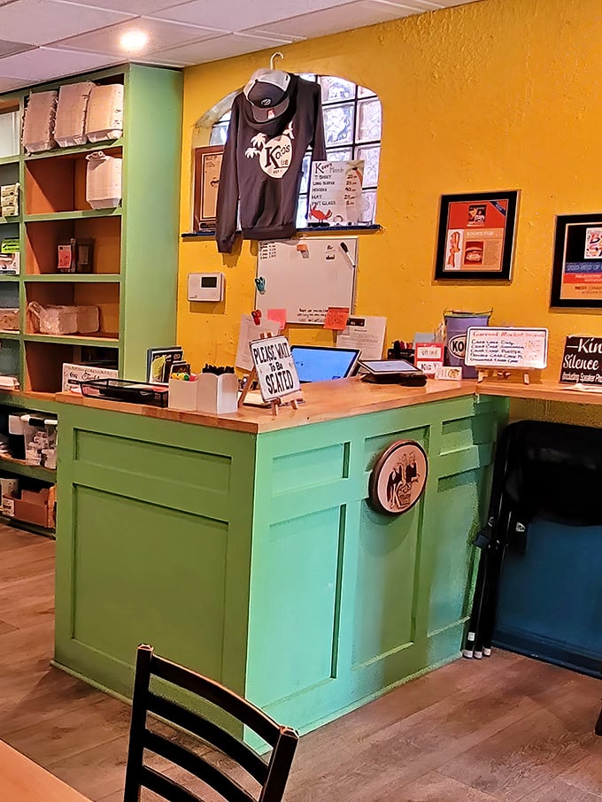 The mint-green host station welcomes you with a "Please Wait To Be Seated" sign – the universal symbol for "good things come to those who wait."