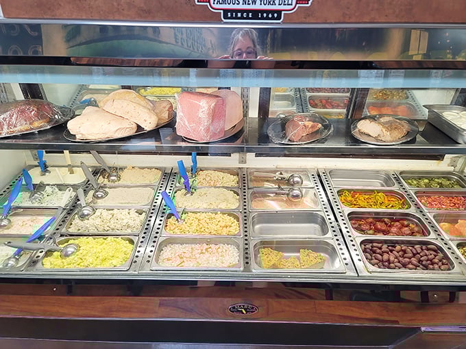 Behind the glass lies the United Nations of deli salads—each container a different country of flavor waiting to be explored.