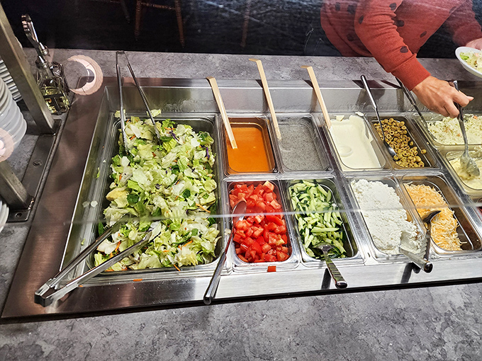 A salad bar that actually makes you want to eat vegetables. Fresh, colorful, and thoughtfully arranged – the opening act before the comfort food headliners.