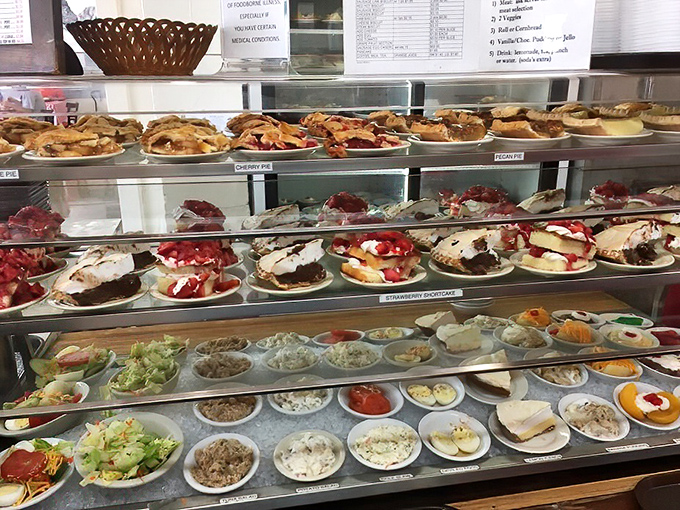 Behold the dessert case – a glass-enclosed museum of Southern sweetness where diet plans go to die gloriously.