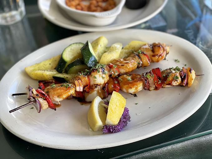 Skewers that prove everything tastes better on a stick. Those perfectly grilled shrimp and scallops are summer on a plate.