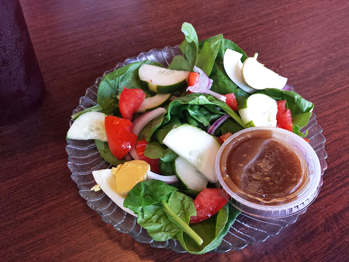 This isn't just a side salad—it's nature's palette of greens, reds, and whites that somehow tastes even better than it looks.