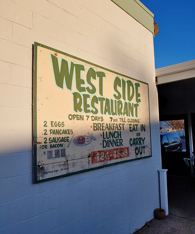 This weathered sign tells you everything you need to know. No QR codes, no pretense—just the promise of two eggs, two pancakes, and two sausages that won't disappoint.
