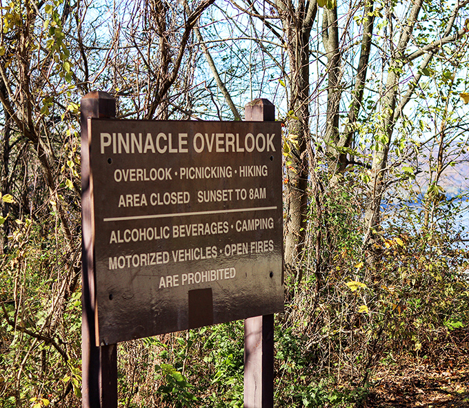 The sign says it all—paradise has operating hours. Pinnacle Overlook welcomes daytime adventurers while preserving the night for wildlife and stargazers.
