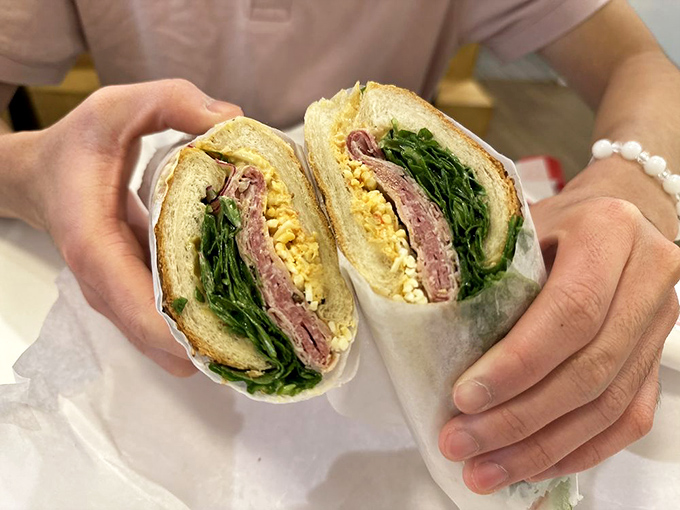 The So Long Sal sandwich is architectural perfection—each layer visible like geological strata of deliciousness that would make any geologist hungry.