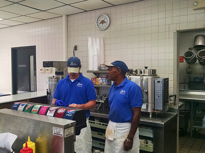 Behind the scenes where the magic happens – skilled hands crafting comfort food with the precision of seasoned professionals.