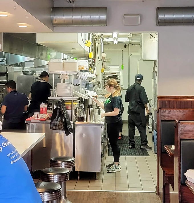The hardworking crew in action – these folks know their way around a spatula and a smile.