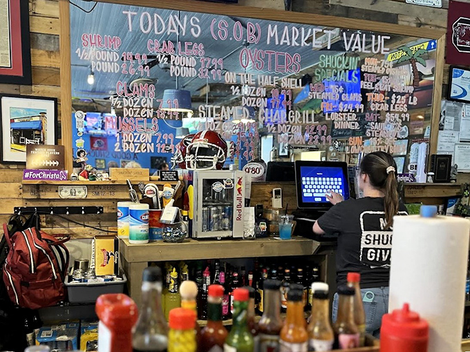 The market price board – a colorful reminder that you're eating what the ocean decided to share today. Fresh isn't just a promise, it's the business model.