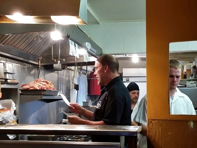 The kitchen commander in his natural habitat—where orders are shouted, bacon is sizzling, and breakfast perfection is just another Tuesday.