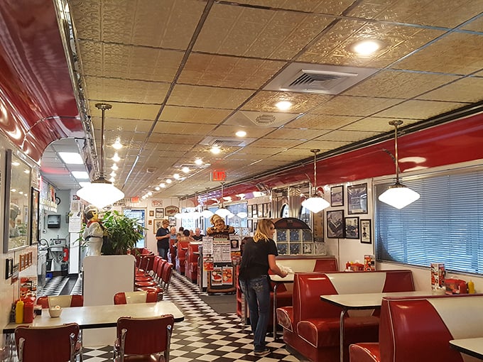 The classic diner layout: counter seating for solo diners and people-watchers, booths for lingerers, and staff who move with practiced efficiency.