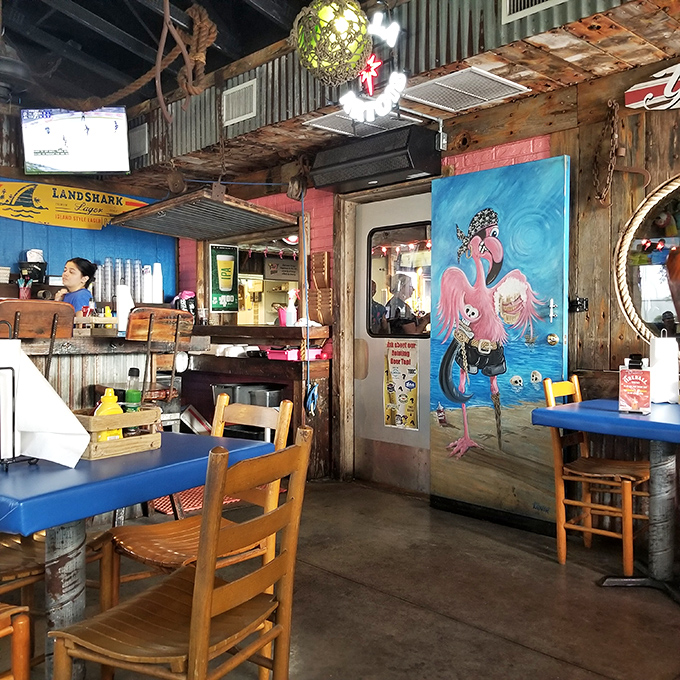 The rustic interior features whimsical flamingo art that reminds you this place doesn't take itself seriously—just its seafood.