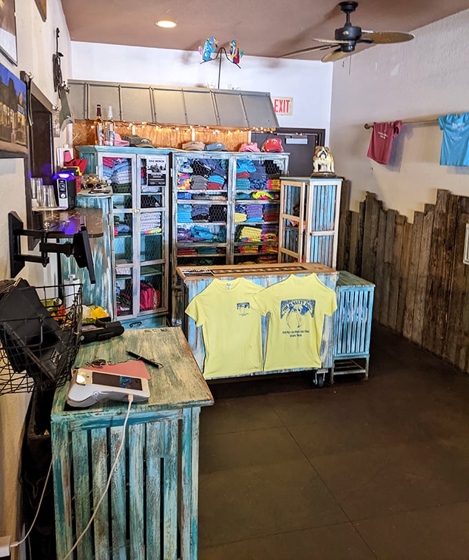 The gift shop corner—because sometimes you need a t-shirt to prove you discovered this place before your friends did.
