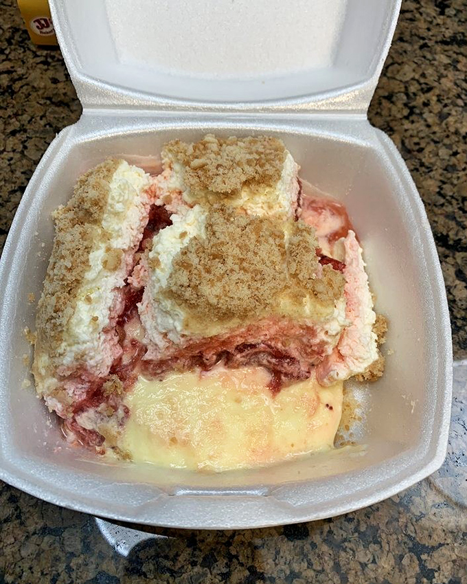 This isn't just dessert, it's a strawberry dream state—layers of sweet, tart, and creamy that make you question why you ever waste calories elsewhere.
