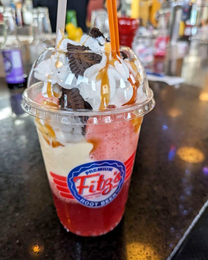 This isn't just a float—it's a carnival in a cup, where whipped cream mountains meet colorful soda seas. Spoons required!