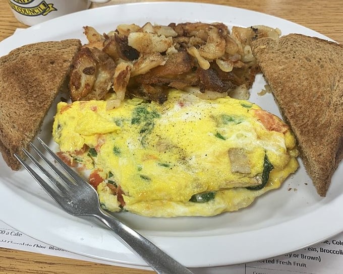 This vegetable omelet isn't just healthy-ish breakfast—it's how you lie to yourself about balancing out yesterday's pizza choices.