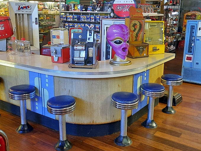 That purple alien isn't the strangest thing you'll find here. The vintage soda fountain counter has served up more stories than milkshakes.