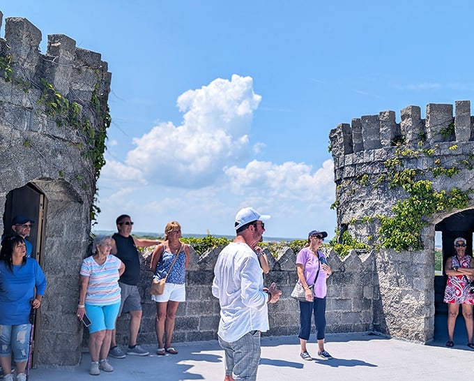 A tour group gathers on the castle's upper level, probably wondering how they teleported from Florida to medieval Ireland without a passport.