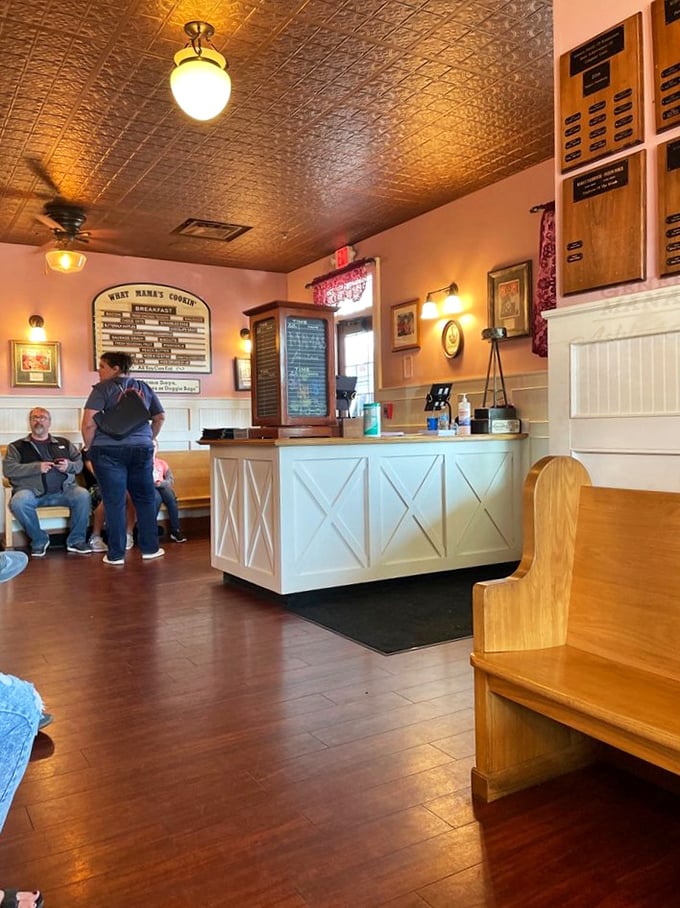 The waiting area with its pressed tin ceiling and farmhouse counter isn't just charming—it's where anticipation becomes an appetizer. 
