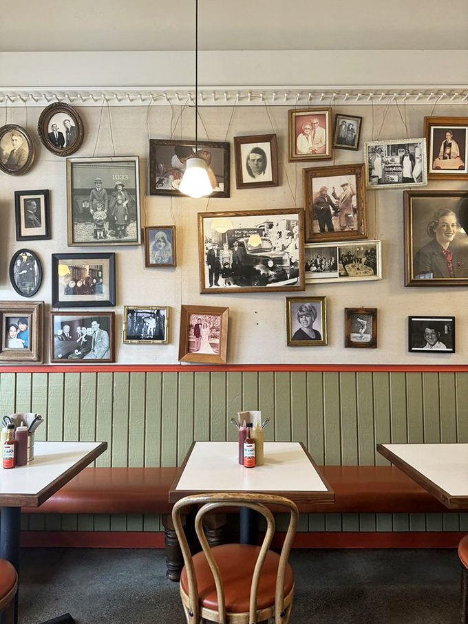 The wall of memories – vintage photos watching over diners like Jewish grandparents silently asking, "You're eating enough, yes?"