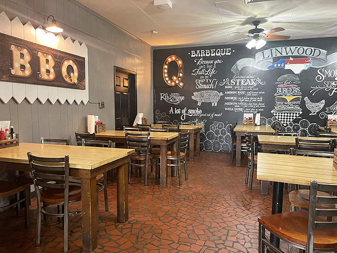 The chalkboard wall isn't just decoration – it's a roadmap to deliciousness, illustrated with the universal language of meat cuts.