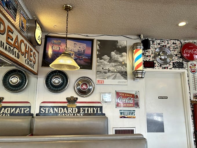 The walls tell stories better than most novels. Vintage signs, hubcaps, and memorabilia create the perfect backdrop for comfort food conversations.