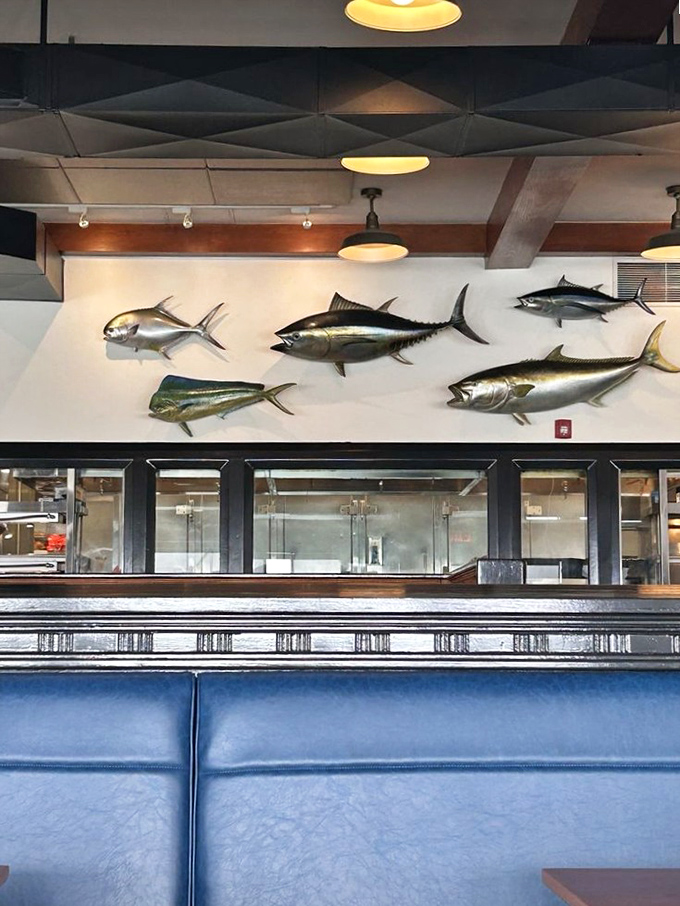 Maritime history decorates the walls, silently judging whether you ordered wisely. (The fish always know.)