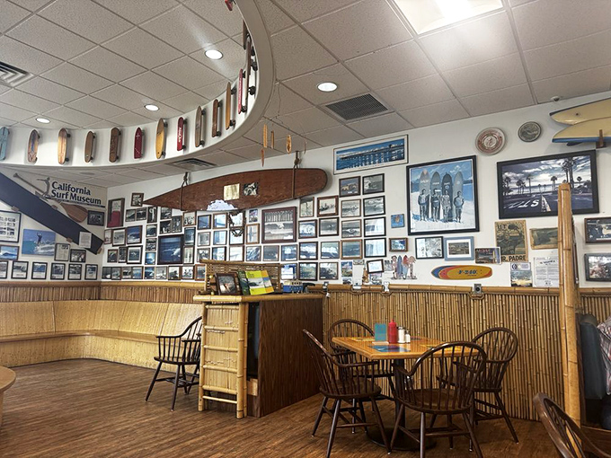The wall of fame showcases California's surf heritage, turning a simple meal into an immersive journey through coastal culture.