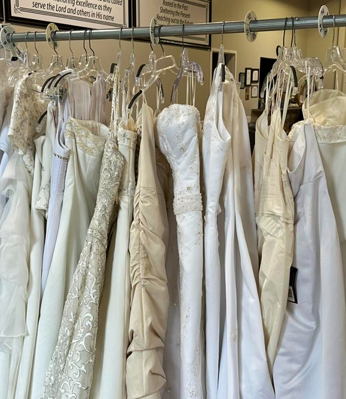 Wedding gowns waiting for their second dance. Each dress holds the promise of new beginnings and something borrowed.
