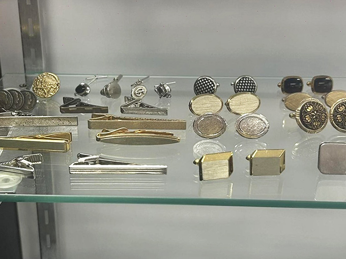 Cufflinks and tie clips arranged with museum-worthy precision—proving that even the smallest accessories deserve the spotlight.