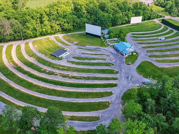 The perfect parking pattern revealed from above—concentric crescents designed for optimal viewing. Nature provides the perfect theater backdrop.