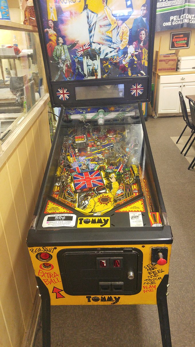 The pinball machine—providing entertainment while you wait for your pizza masterpiece. Tommy would approve of this rock-and-roll diversion.