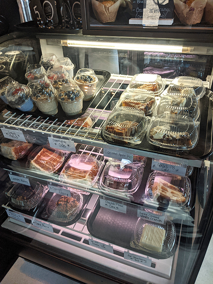 The pastry case—where willpower goes to die and "I'll just have a bite" becomes the lie we tell ourselves.