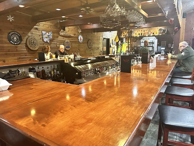 The bar's warm wooden expanse invites you to pull up a stool and share stories with strangers who'll feel like neighbors by your second drink.