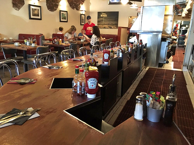 Long communal tables invite strangers to become temporary breakfast companions, united by the universal language of "Oh my god, look at that plate!"