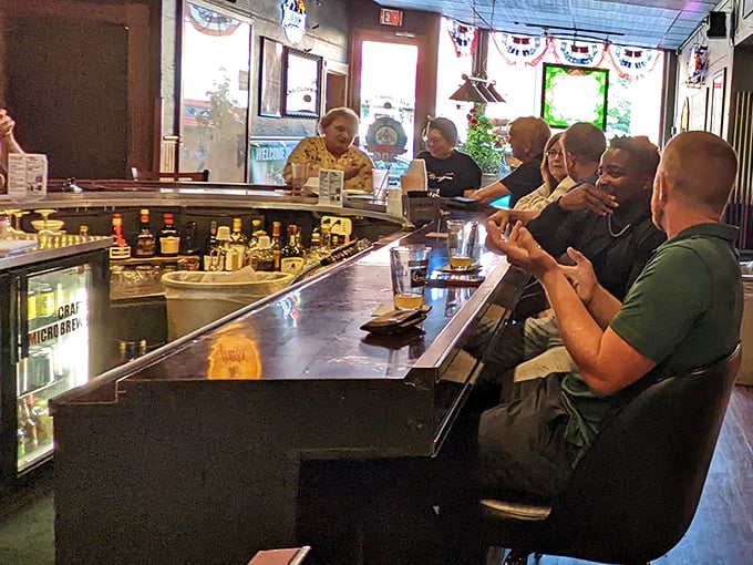 The regulars' section—where everybody knows not just your name, but your drink order, your kids' names, and that fishing story you've told seventeen times.