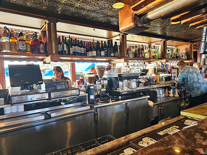 The bar area balances nautical charm with serious beverage credentials—the kind of place where both tourists and locals find common ground over cold beer.